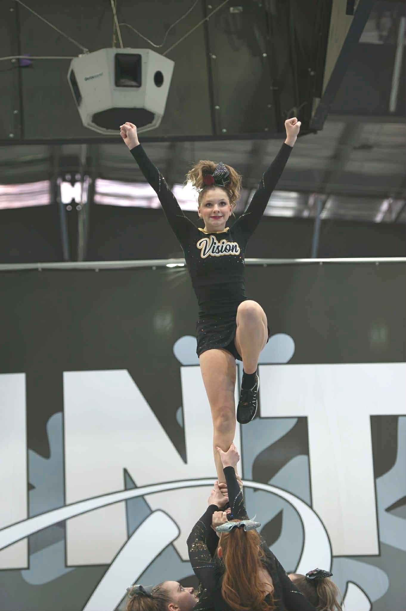 Local U8 and U12 cheerleaders rally behind coach at Winter Riot Cheer ...