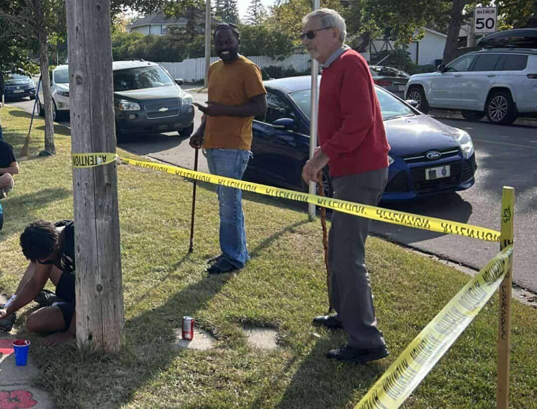 Volunteers paint sidewalks to beautify Airdrie Legion - DiscoverAirdrie ...