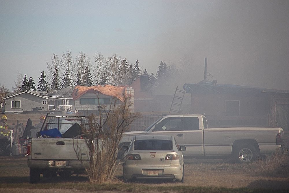 Public urged to avoid area as crews battle fire near Chestermere ...