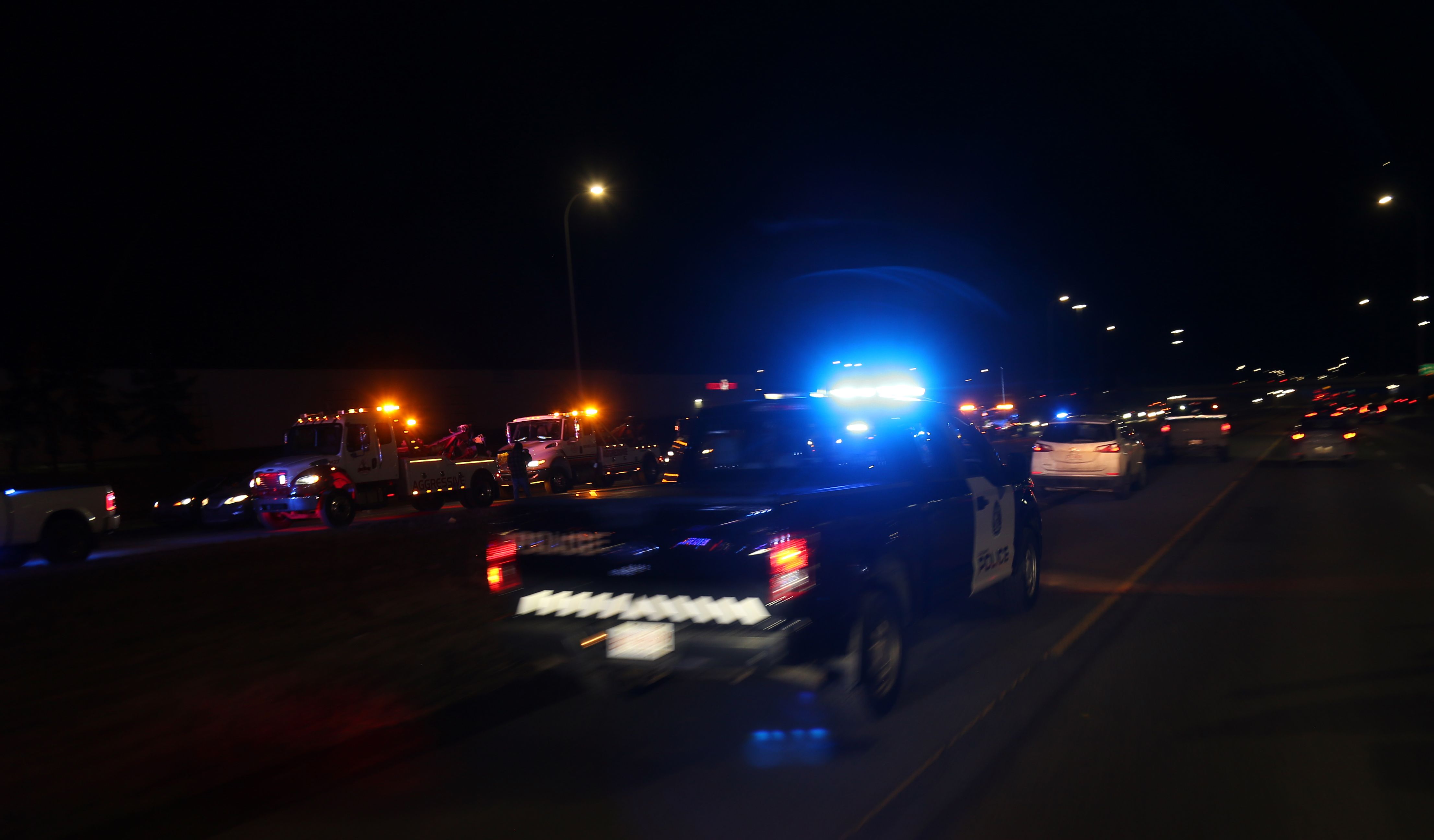 Tow trucks and emergency crews line Calgary roadway with message for ...